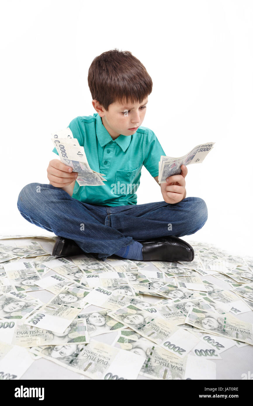 boy sitting on money, money concept, how to be successful, isolated on ...