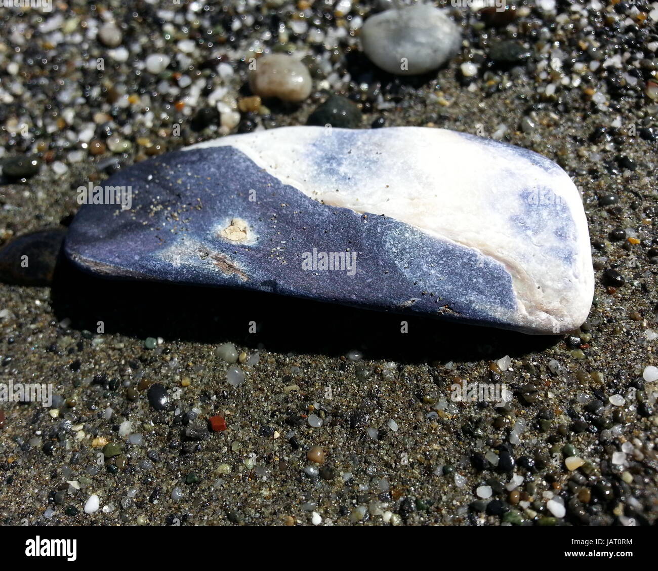 Striking Blue and White Beach Stone Stock Photo - Alamy