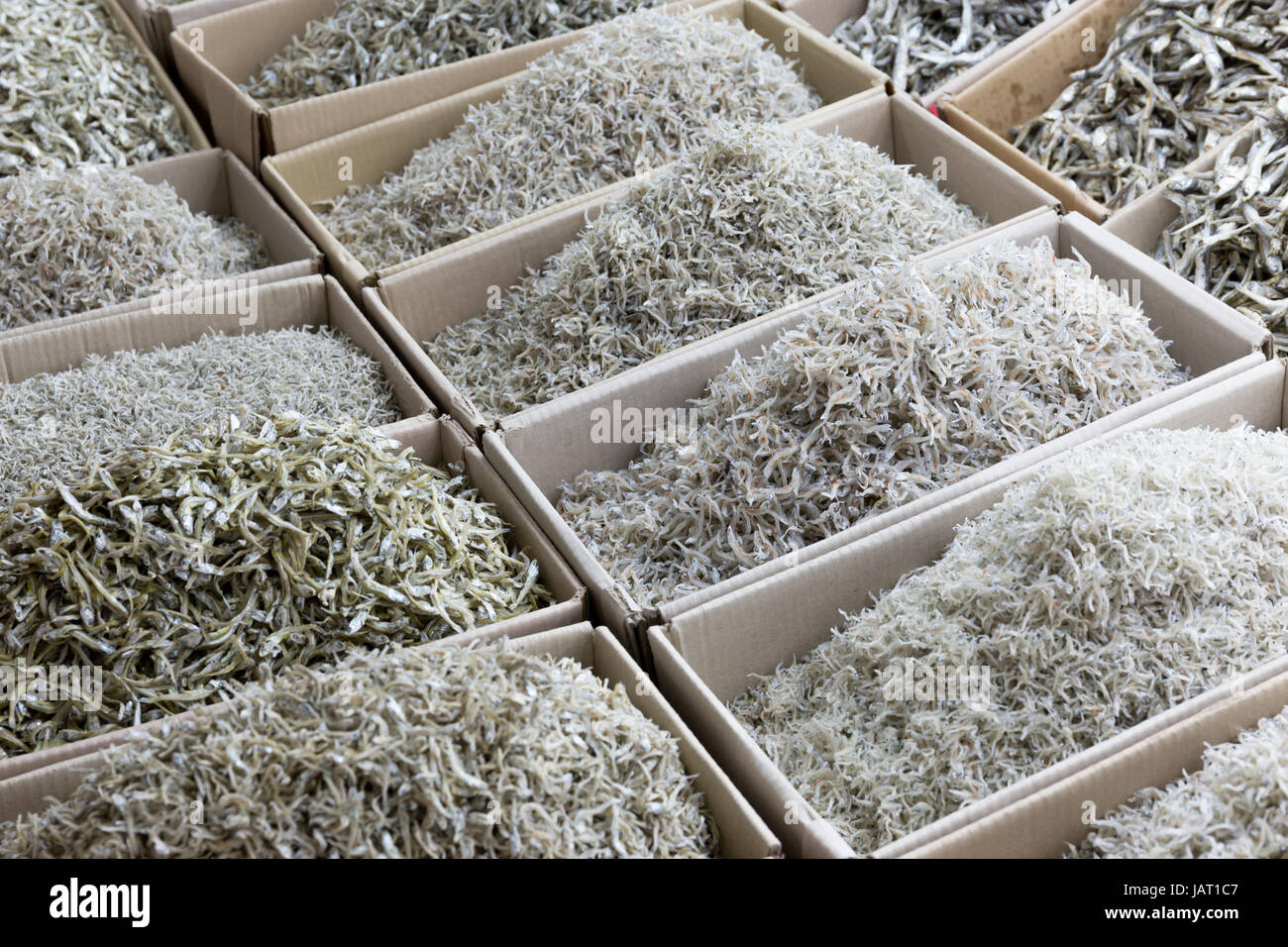 Small silver dried fish Stock Photo - Alamy