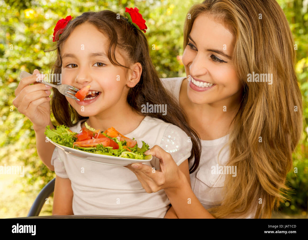 Mother and daughter having fun eating a healthy launch Stock Photo - Alamy