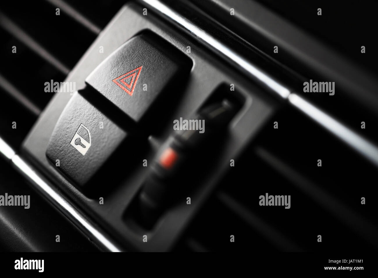 Detail of a warning button in a car Stock Photo - Alamy