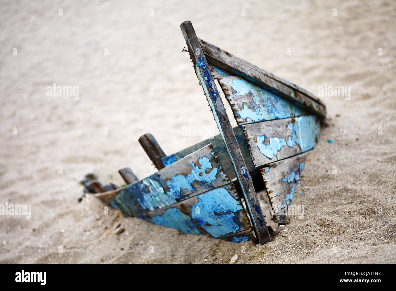 Color picture of an abandoned boat stuck in sand Stock Photo - Alamy