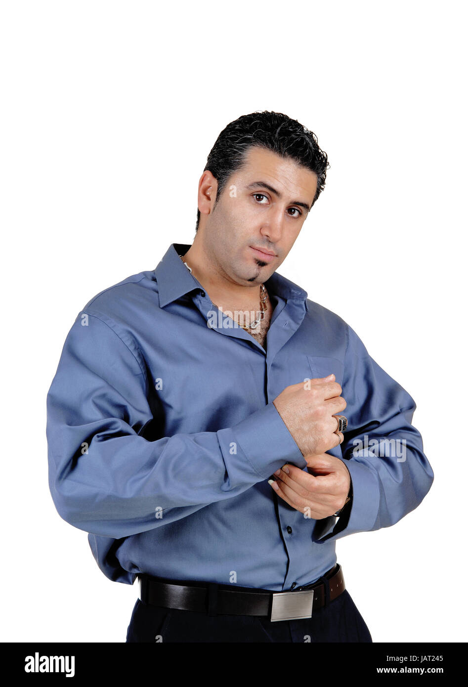 A young handsome man standing for white background very relaxed looking ...
