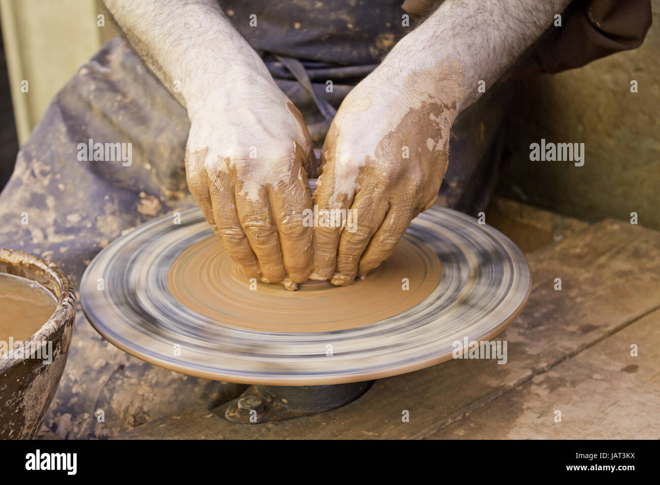 Craftsman hands working on pottery clay and crafts Stock Photo - Alamy