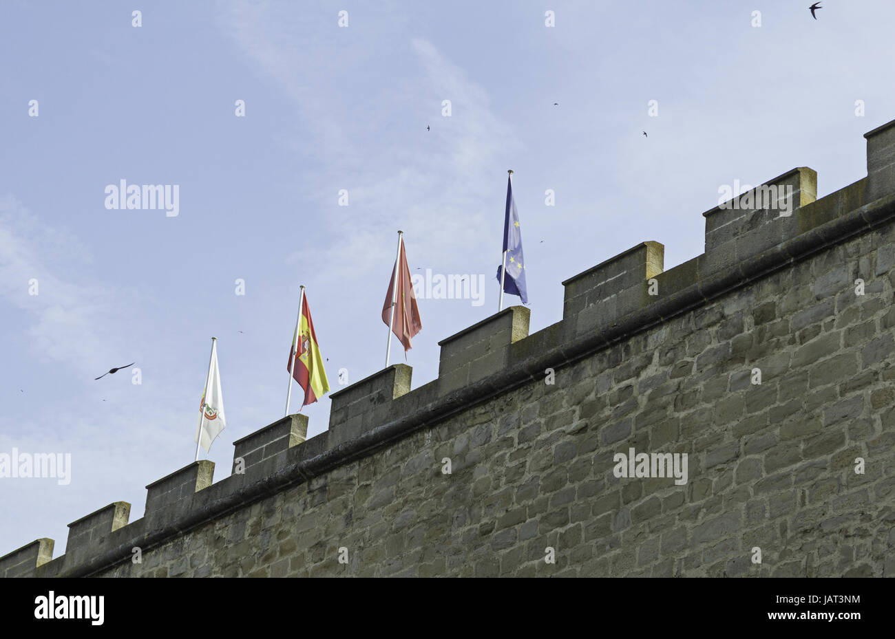 Stone fortification in Spain with symbolic flags, construction and ...