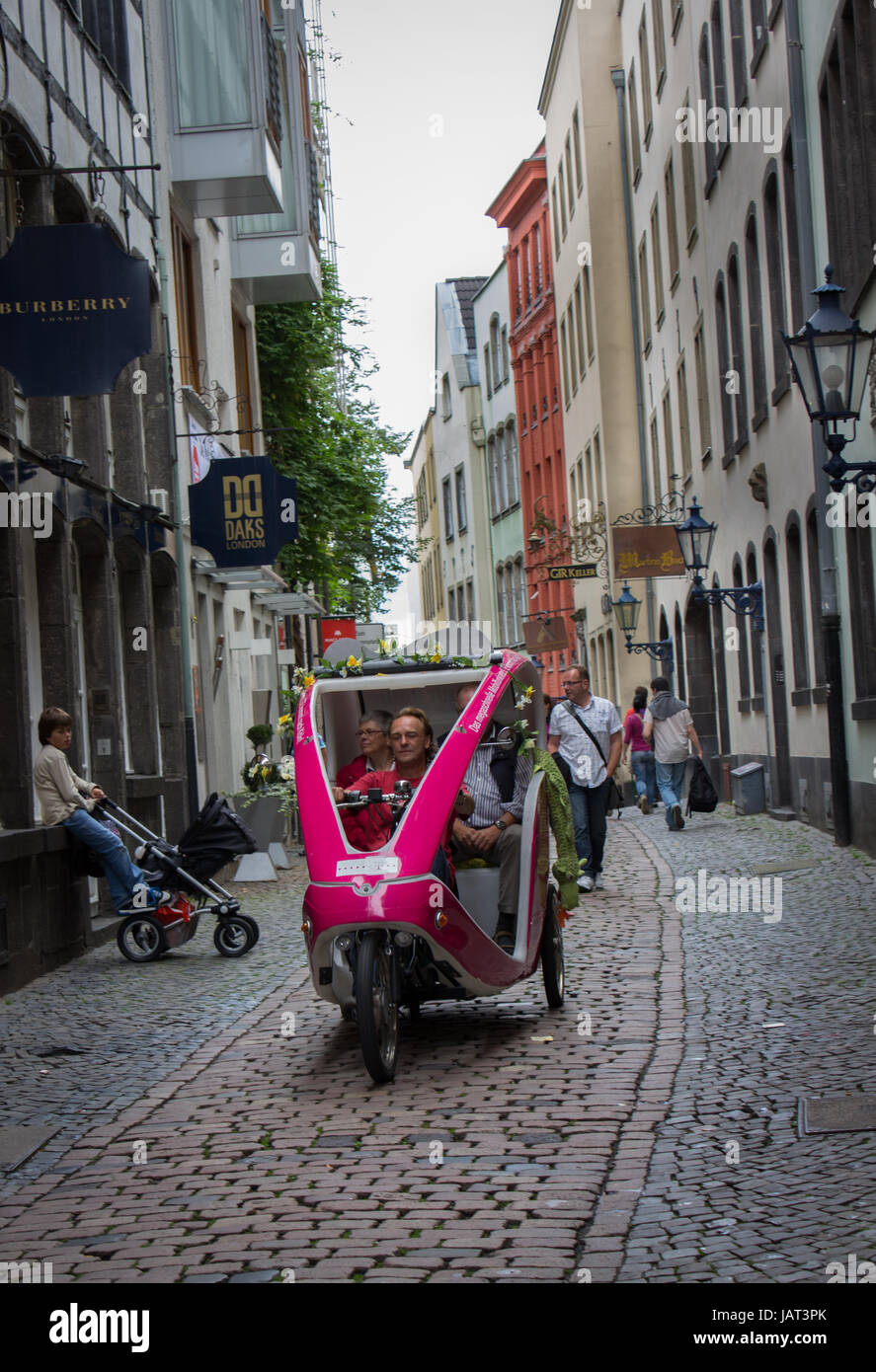 Velo taxi rickshaw service tourists in Cologne, Germany Stock Photo - Alamy