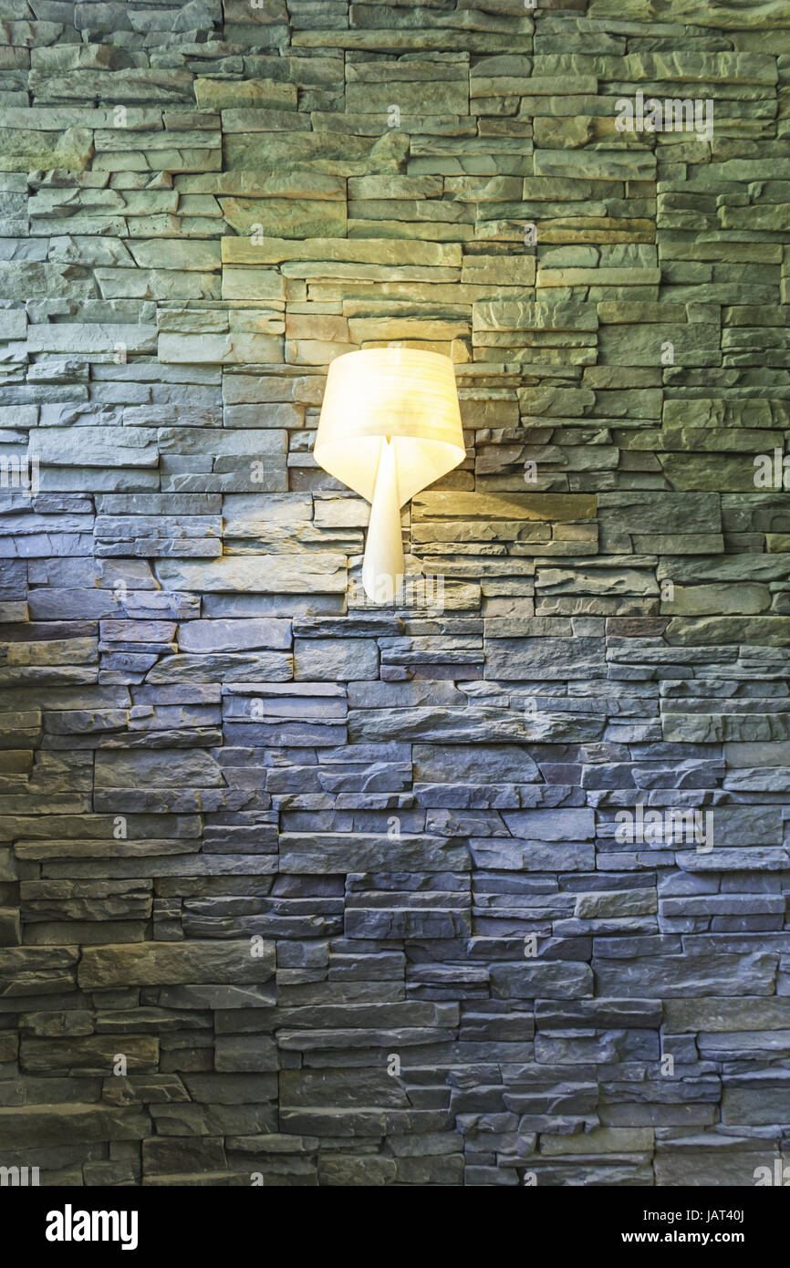 Lamp lit stone wall house interior, construction and architecture Stock ...