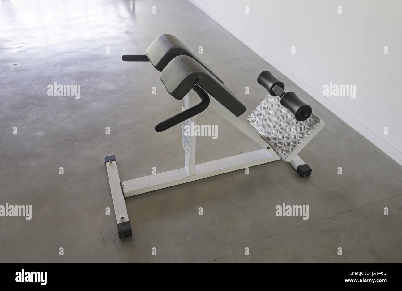 Abdominal machine inside a gym, leisure Stock Photo - Alamy