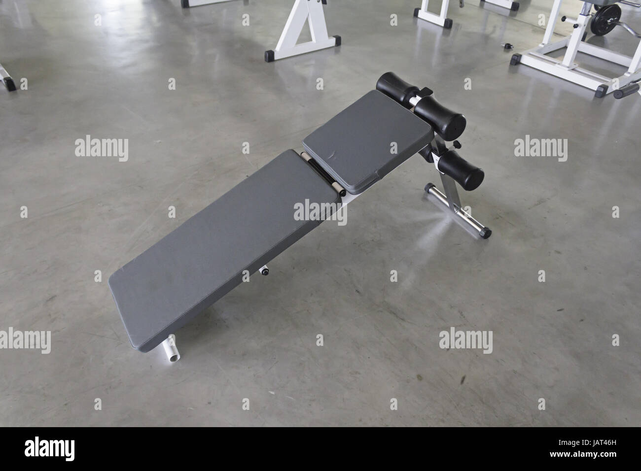 Abdominal machine inside a gym, leisure Stock Photo - Alamy