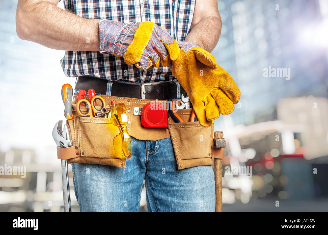 detail of handyman wearing protection gloves Stock Photo - Alamy