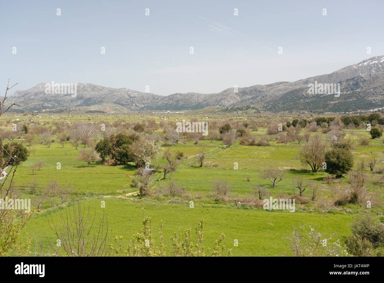view of Lesithi plateau, Crete, Greece showing landscape and mountains ...