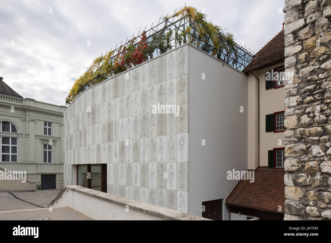 Oblique view of extension's engraved concrete facade. Aarau City Museum ...