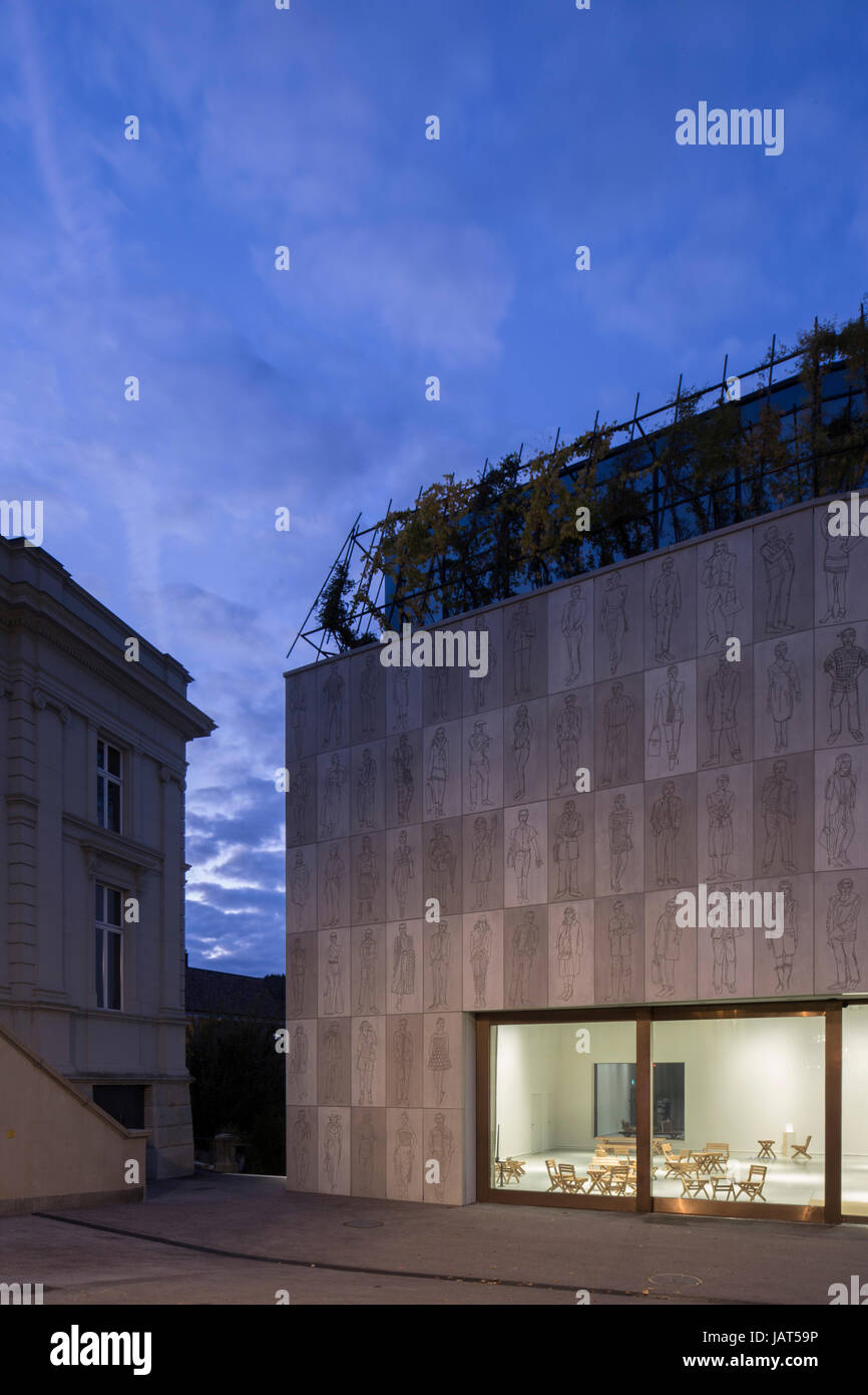 Dusk elevation of extension's engraved concrete facade. Aarau City ...