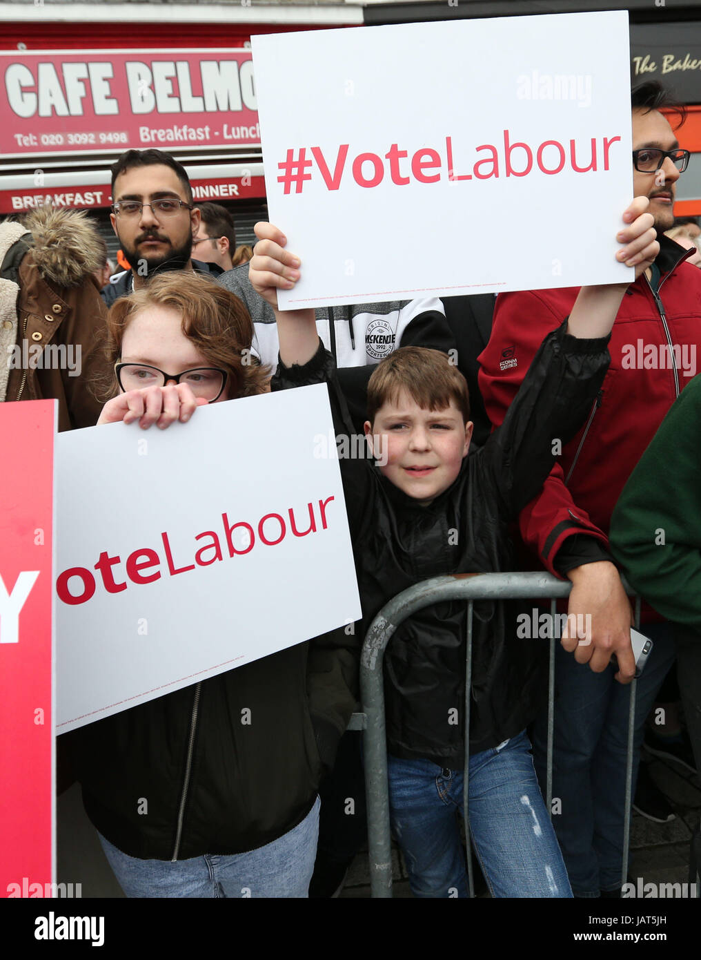 Children holding placards as a crowd gathers ahead of an appearance by ...
