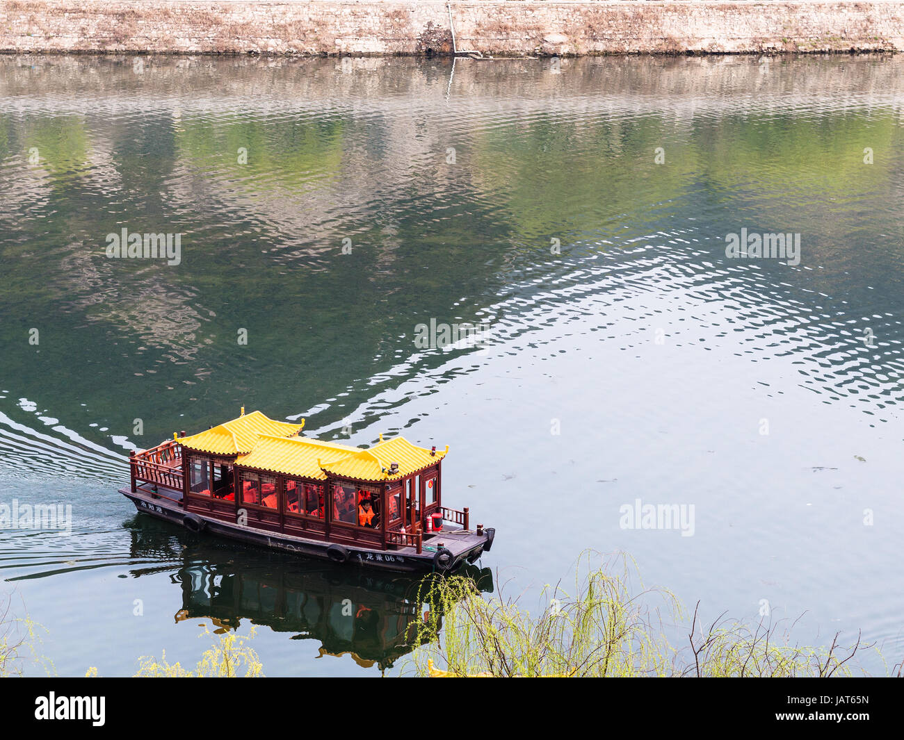 LUOYANG, CHINA - MARCH 20, 2017: boat on Yi river between West and East ...