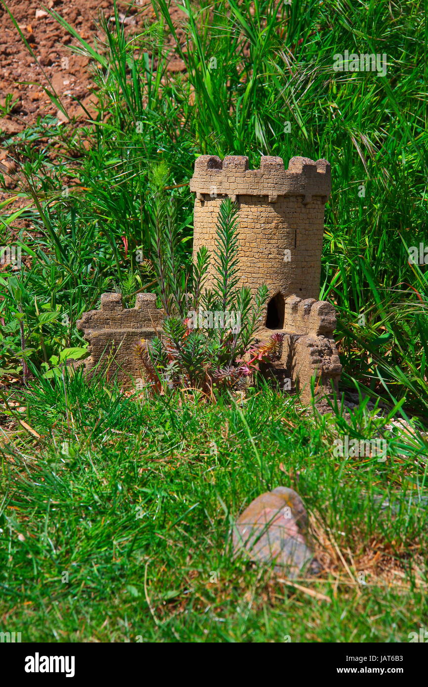 A small hand made model of a ruined or damaged castle, made in very ...