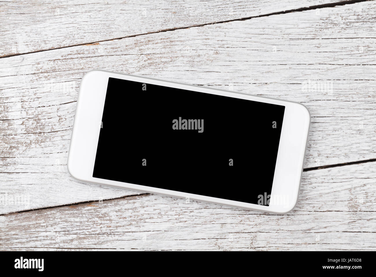 White smartphone on wooden table. Top view Stock Photo - Alamy
