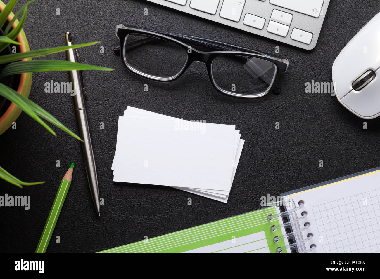 Office desk with computer and supplies. Blank business cards. Top view ...