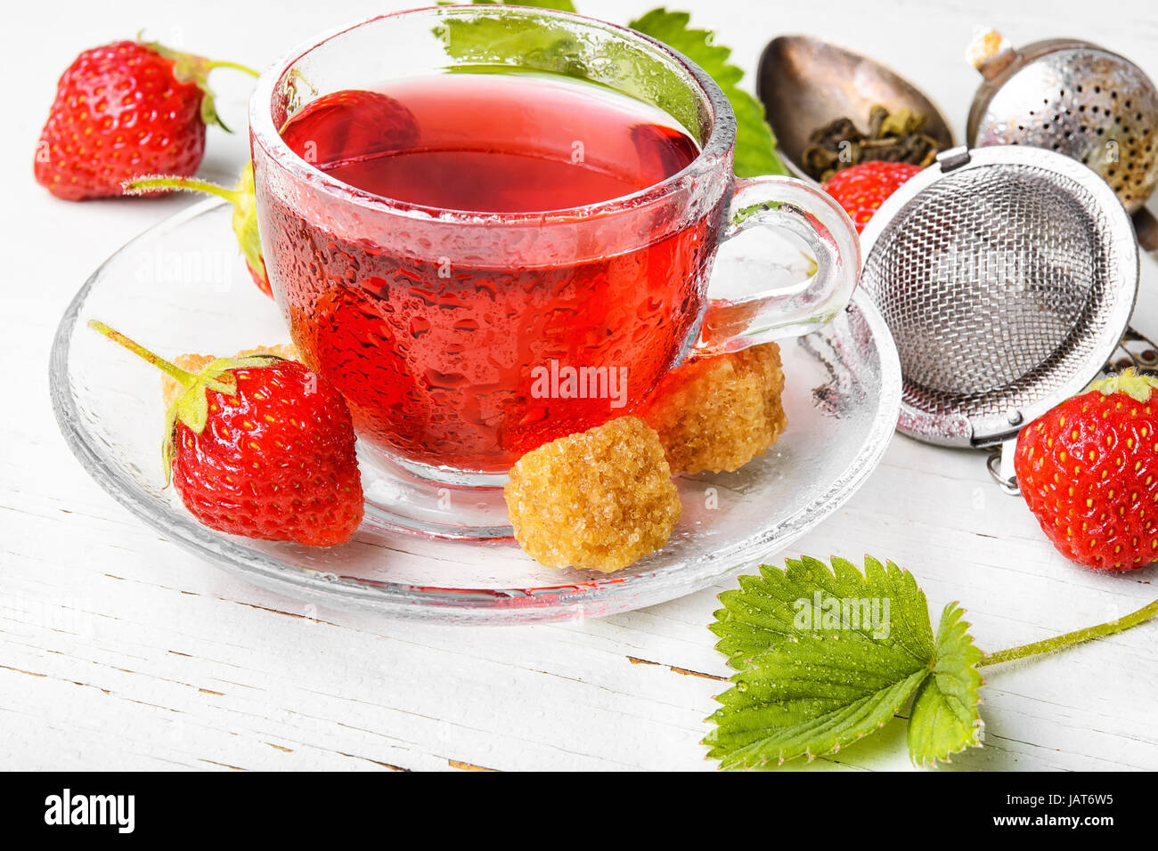 Summer fruit tea with strawberries on light background Stock Photo - Alamy