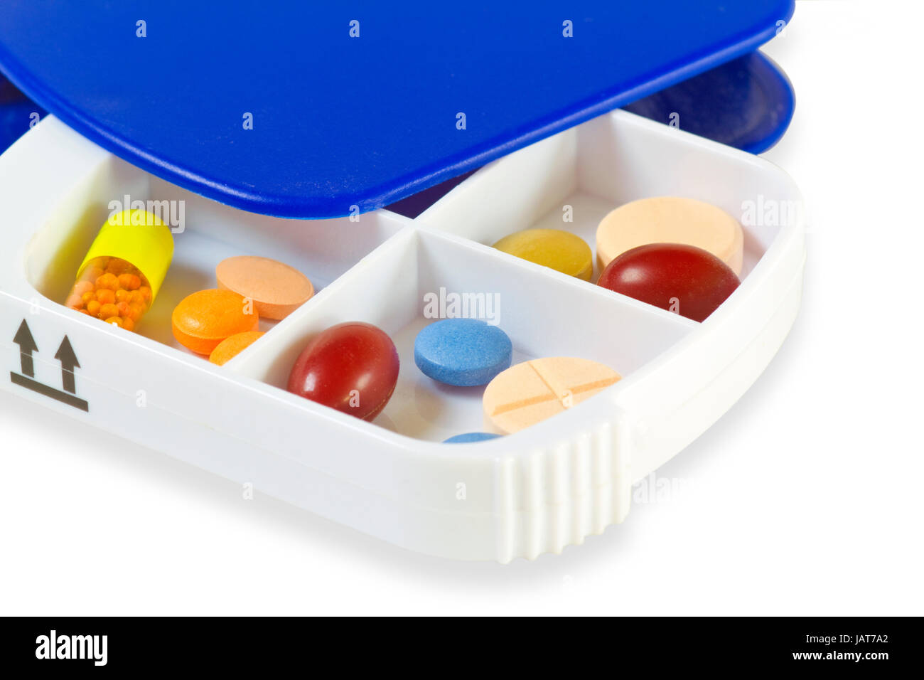 Pill Box with pills on bright background Stock Photo - Alamy
