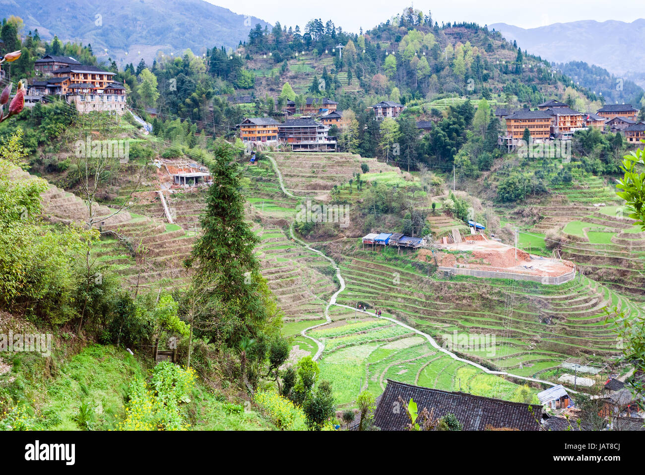 travel to China - above view of Dazhai village on terraced green hills ...