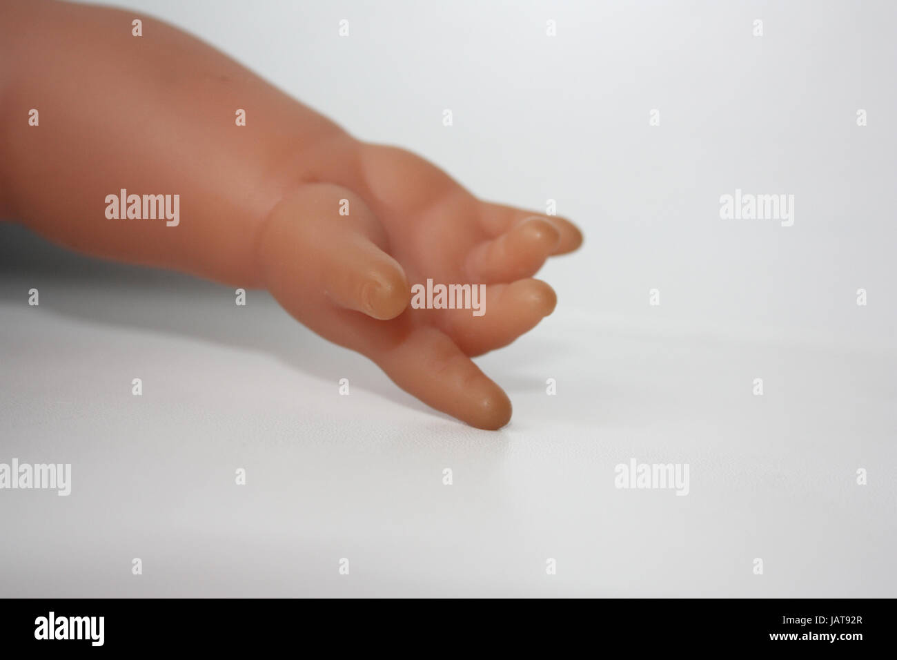 A human hand. Child, doll. Photo for your design Stock Photo - Alamy