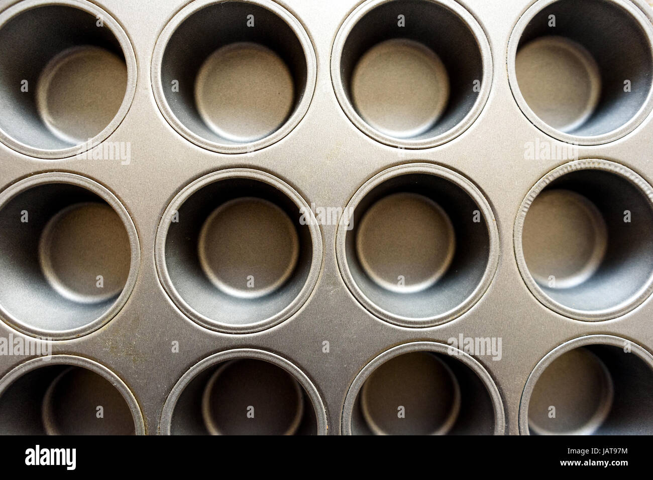 Empty Cup Cake cooking and baking tin from overhead Stock Photo - Alamy