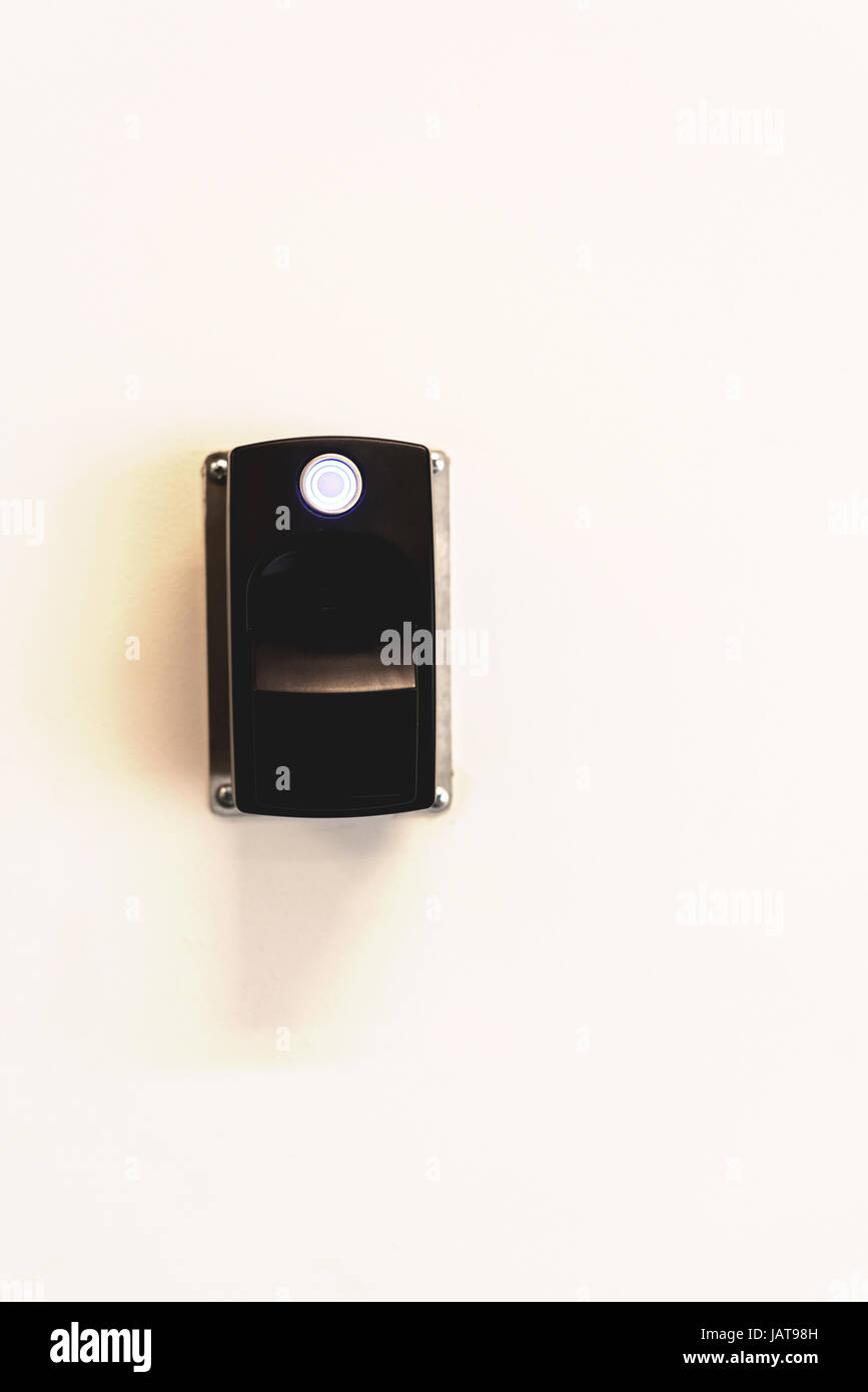 Modern electronic card swipe entry device on a white wall Stock Photo ...