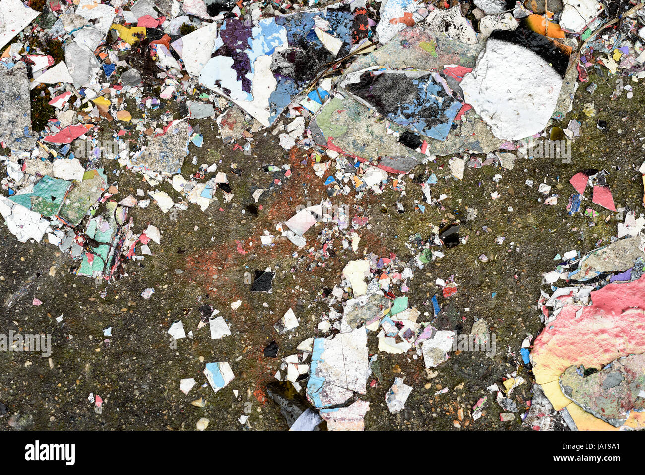 Chipped flaking multicolored spray paint flakes creating an abstract ...