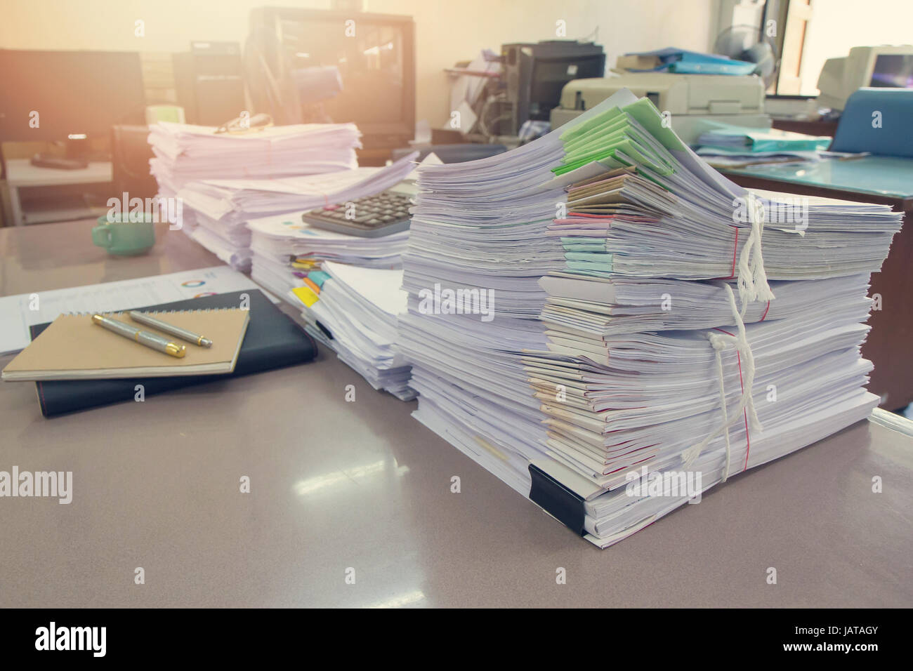 Pile of unfinished documents on office desk, Stack of business paper ...