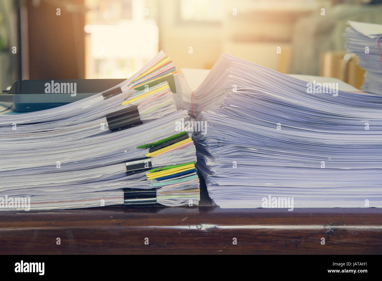 Pile of unfinished documents on office desk, Stack of business paper ...
