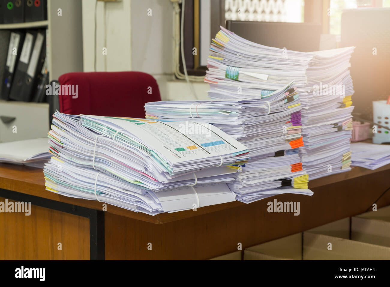 Pile of unfinished documents on office desk, Stack of business paper ...