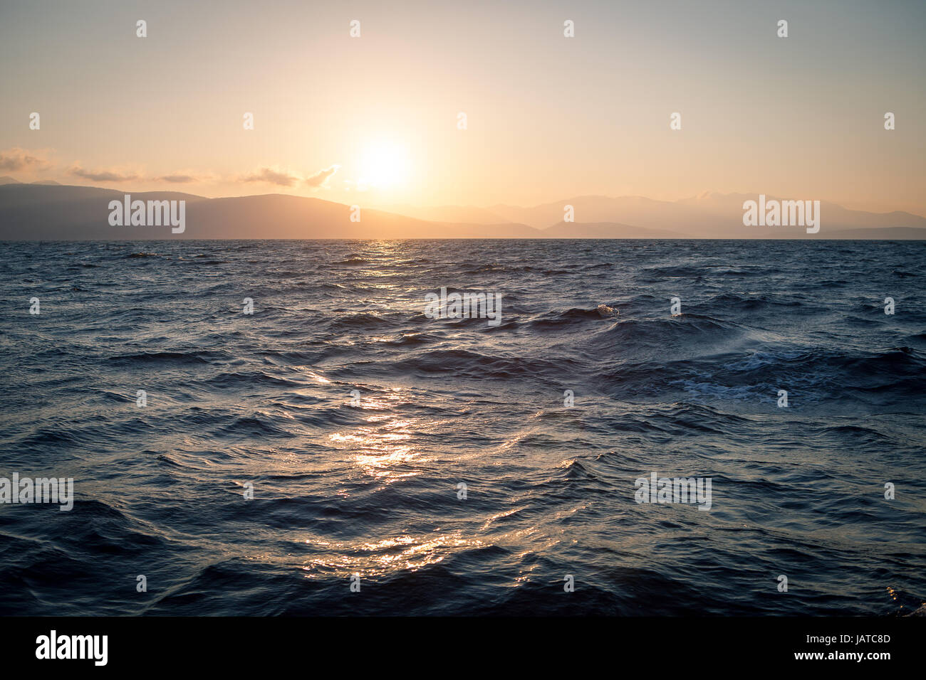Abstract sunrise over ocean sun hi-res stock photography and images - Alamy