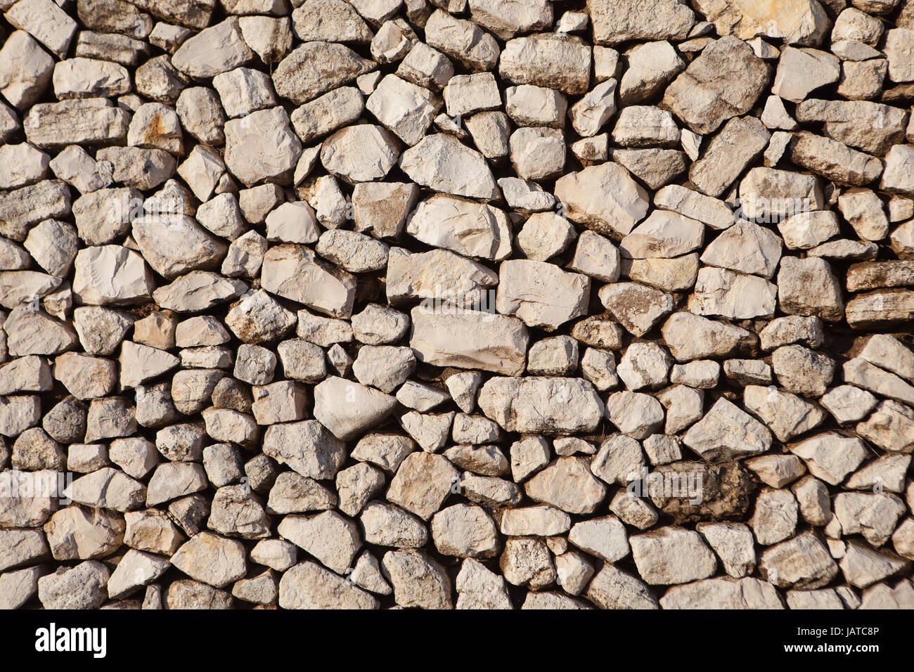 Old wall made of light stones Stock Photo - Alamy