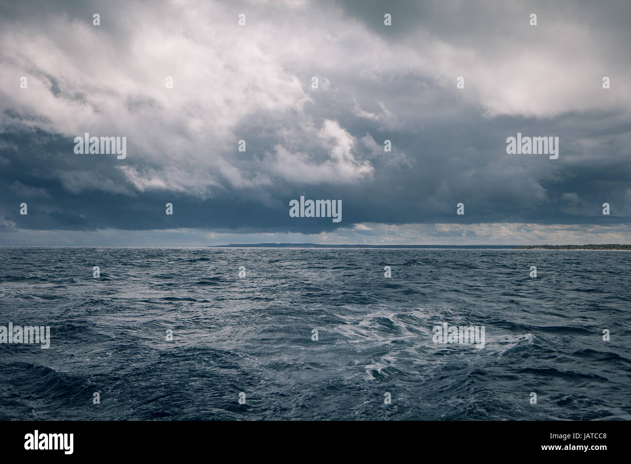 Gloomy weather at sea with rain clouds Stock Photo - Alamy
