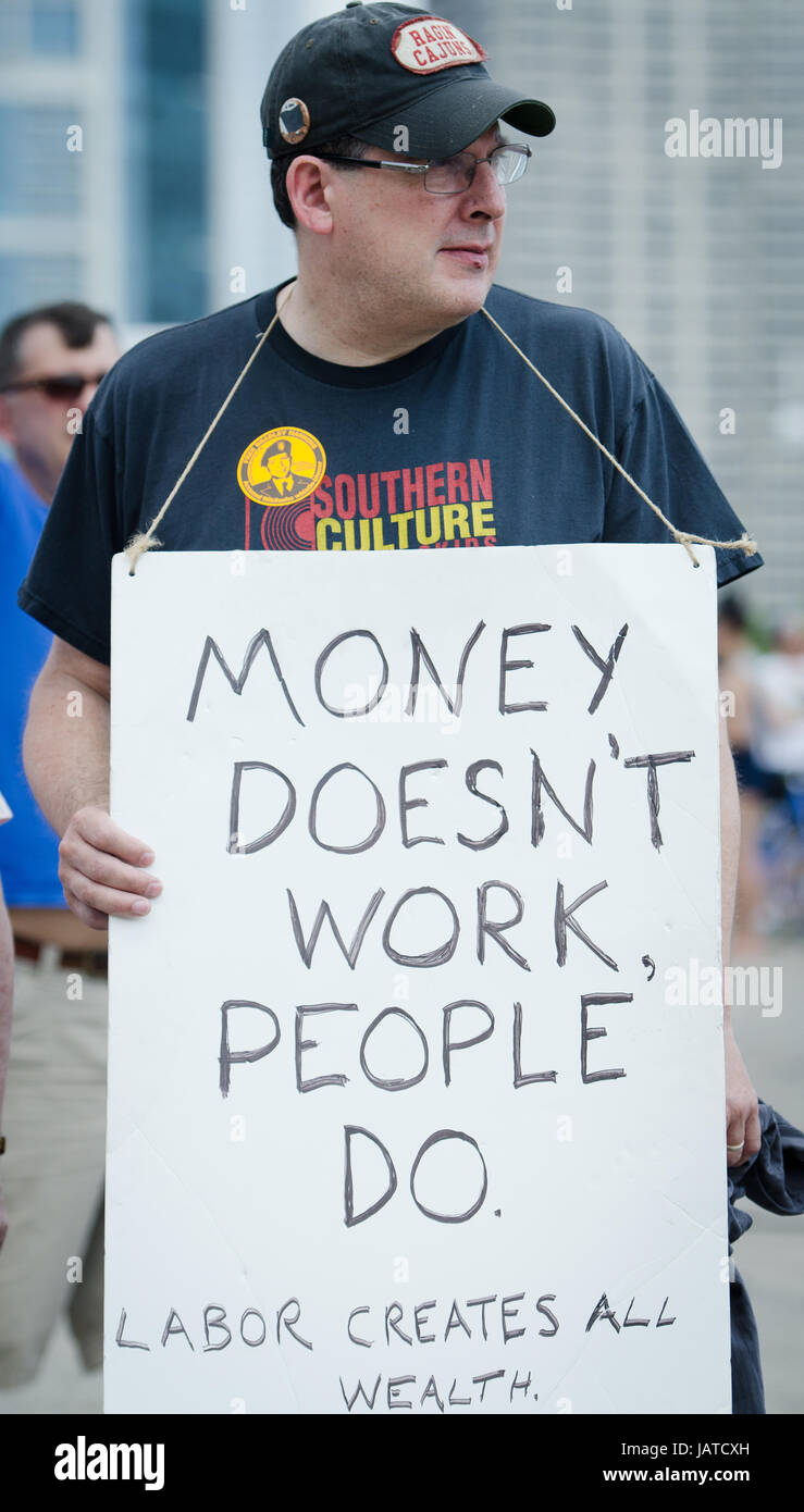 Occupy Chicago supporter Steve Craig of Chicago holds his sign at ...