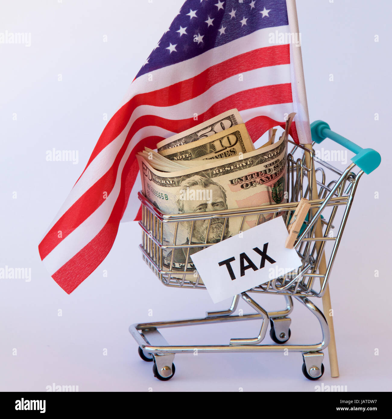 American dollars and flag in a trolley with a US flag Stock Photo - Alamy