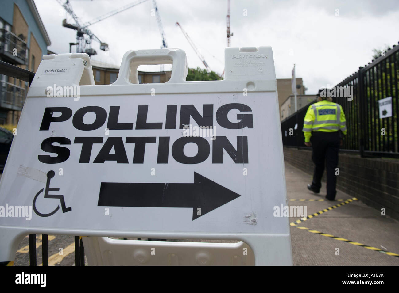 A police officer is stationed outside a polling station at St Saviour's ...
