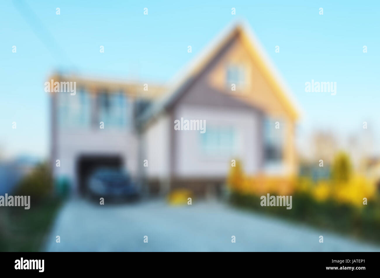 Blur house exterior with a lawn and an entrance to the garage Stock ...