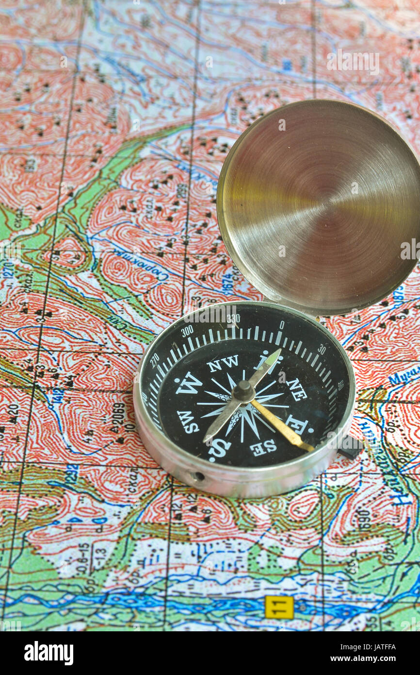 A map with a compass. On a trip - with reliable navigation Stock Photo ...