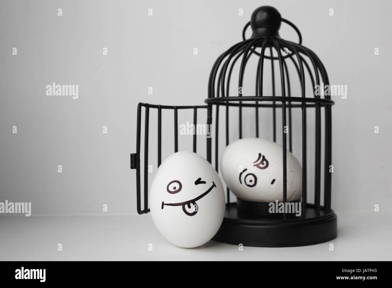 Eggs with painted face. Photo for your design. two eggs. Overseer and ...