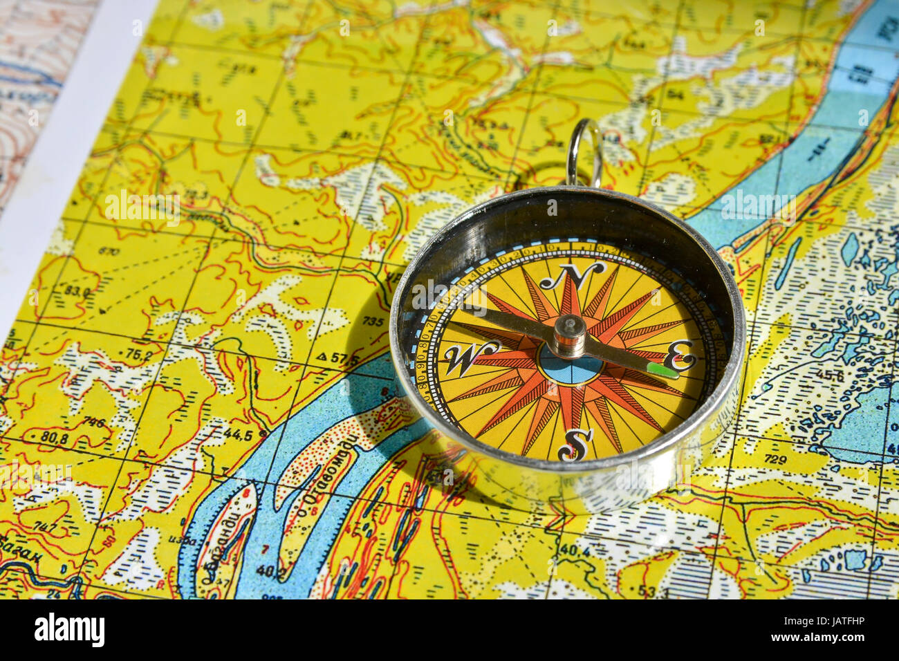 A map with a compass. On a trip - with reliable navigation Stock Photo ...