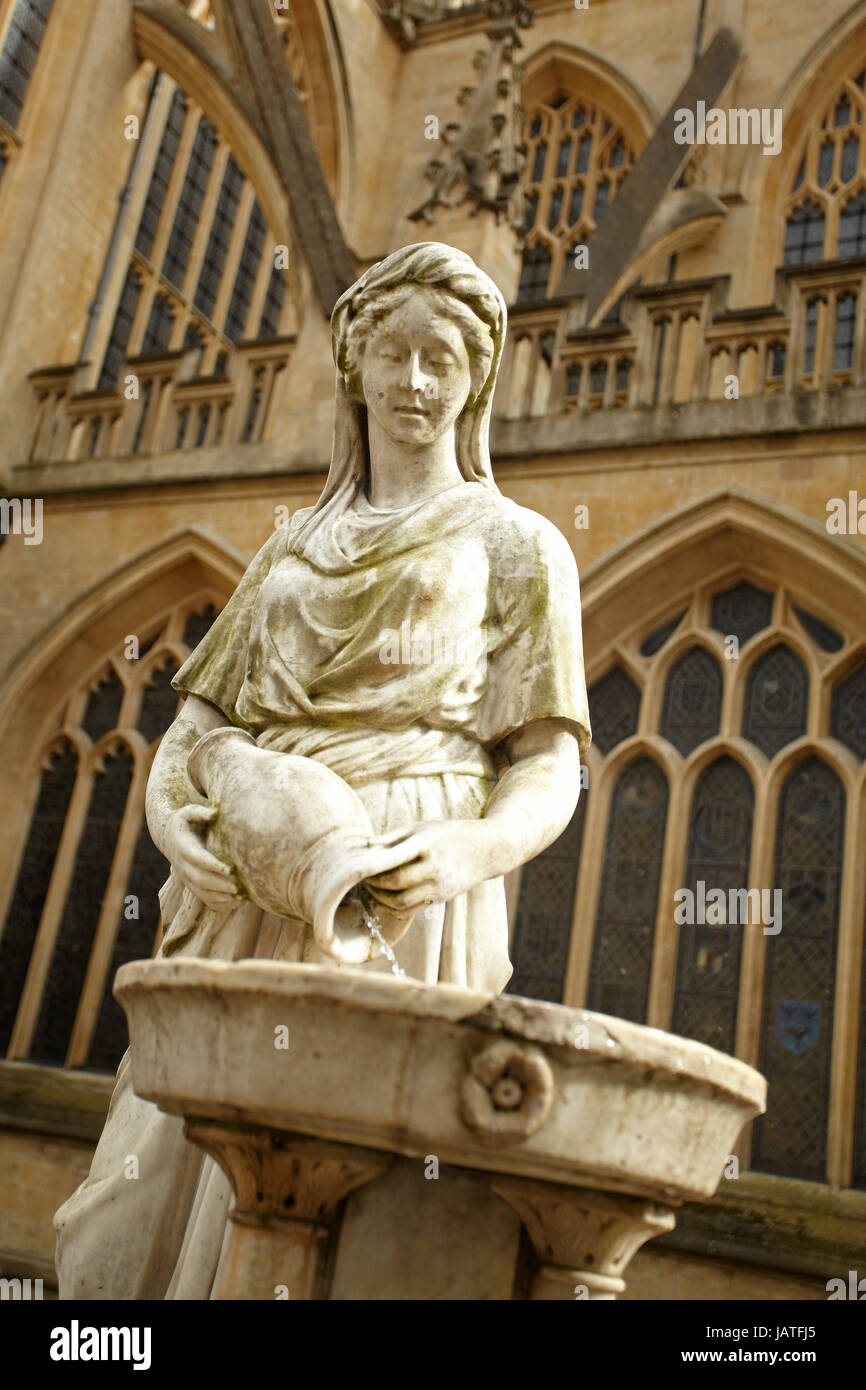 Statue of a woman pouring water outside Bath Abbey Stock Photo - Alamy