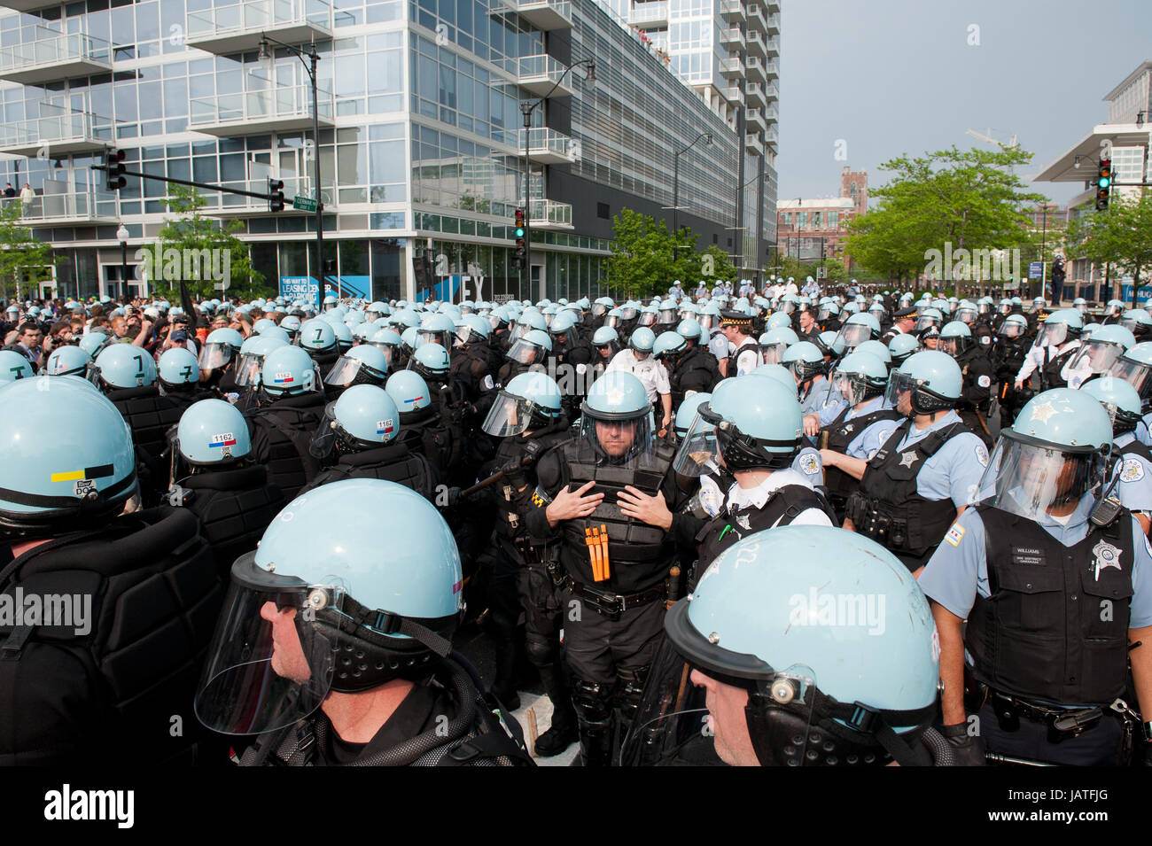 As the ceremony for the Iraq war veterans drew to a close, riot police ...