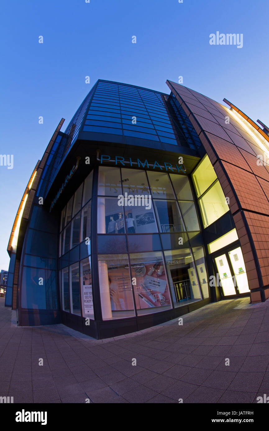 A modern architectural shopping mall in Plymouth city centre at dusk ...