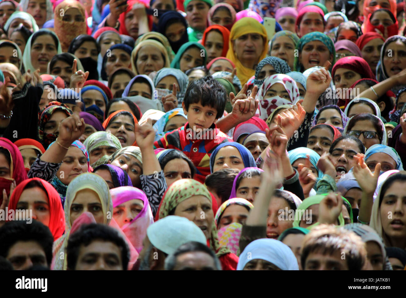 Shopian, India. 07th June, 2017. A young Kashmiri Girl watches the ...