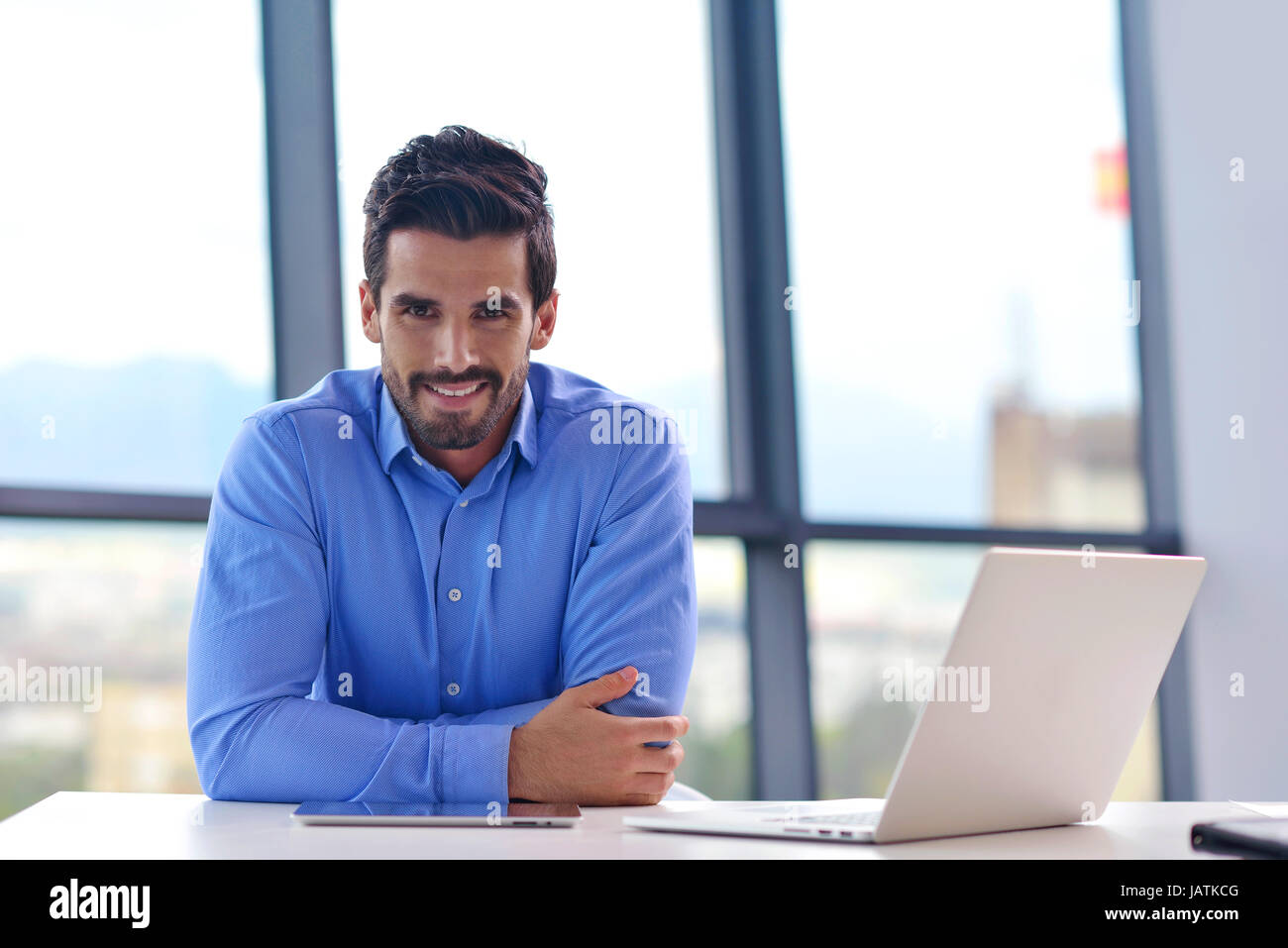 happy young business man work in modern office on computer Stock Photo ...