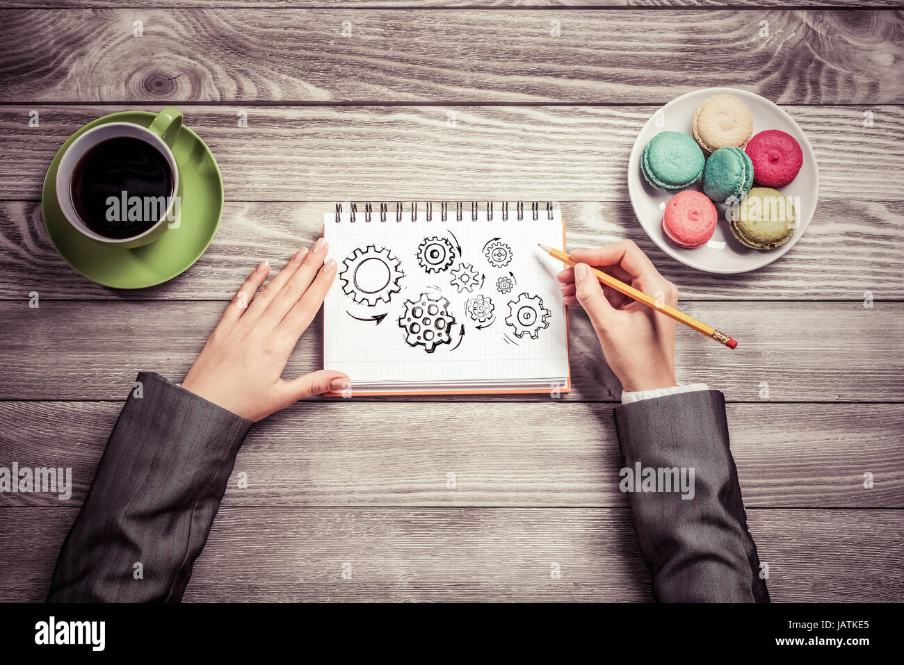 Businesswoman sketching in notepad Stock Photo - Alamy