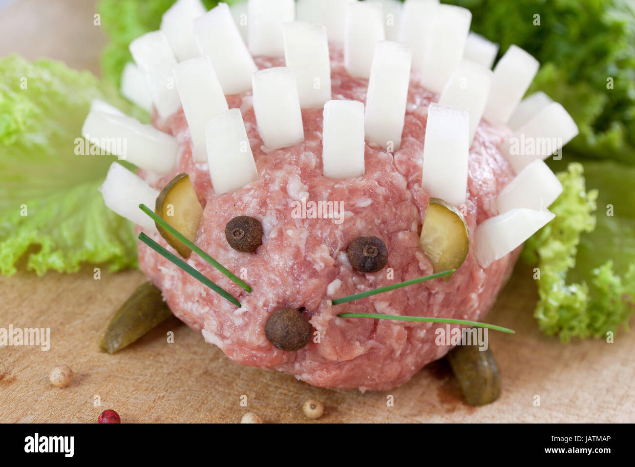 mettigel on wooden board Stock Photo - Alamy