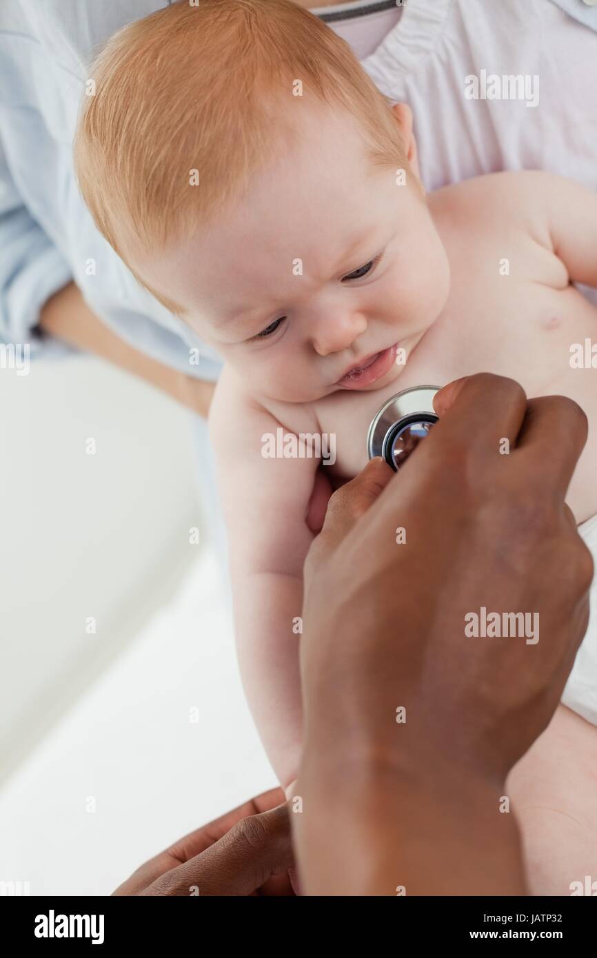 Close up of doctor taking babys heart beat Stock Photo - Alamy
